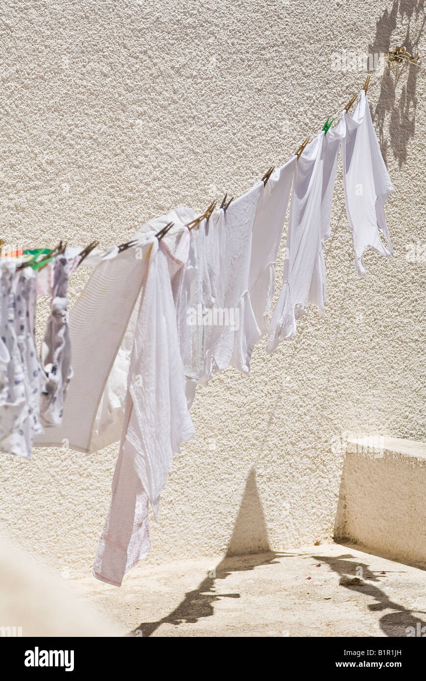 Clothes hanging in the summer breeze Stock Photo - Alamy