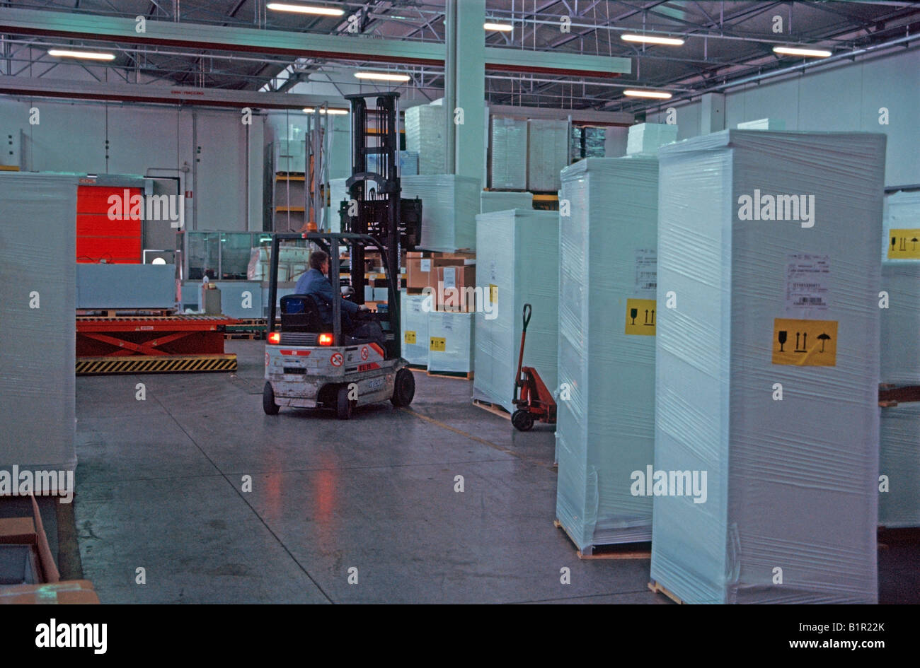 forklift moving goods inside warehouse factory Stock Photo - Alamy