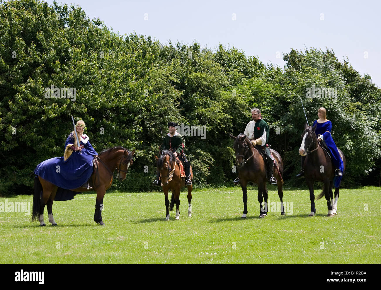 Men and women in medieval costume riding horses, Sussex, England Stock ...