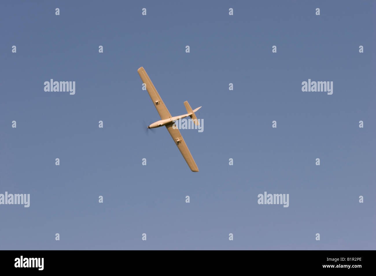A model plane is flying through th sky Stock Photo - Alamy
