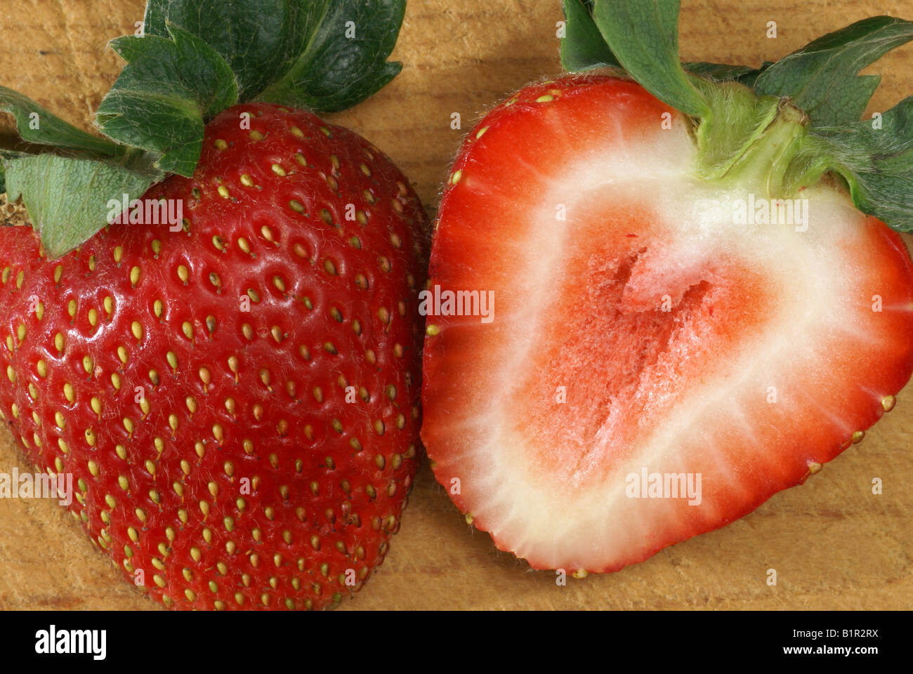 A beautiful strawberry cut in half Stock Photo - Alamy