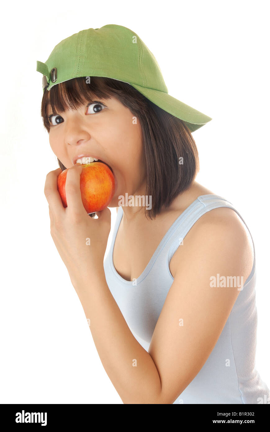 Photo of the hungry model eating fresh apple Stock Photo - Alamy
