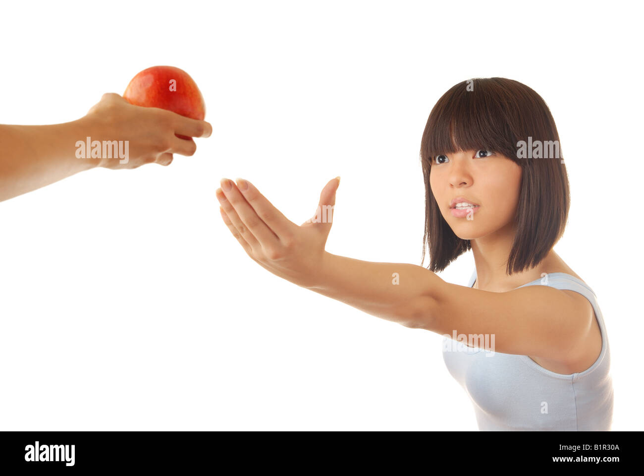 Hand giving the fresh apple to the young lady as a symbol of help Stock ...