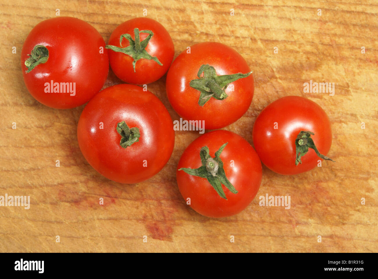 Six cherry tomatoes Stock Photo - Alamy