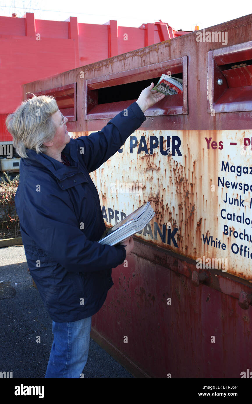 RECYCLING USING A PAPER BANK FOR MAGAZINE DISPOSAL Stock Photo - Alamy