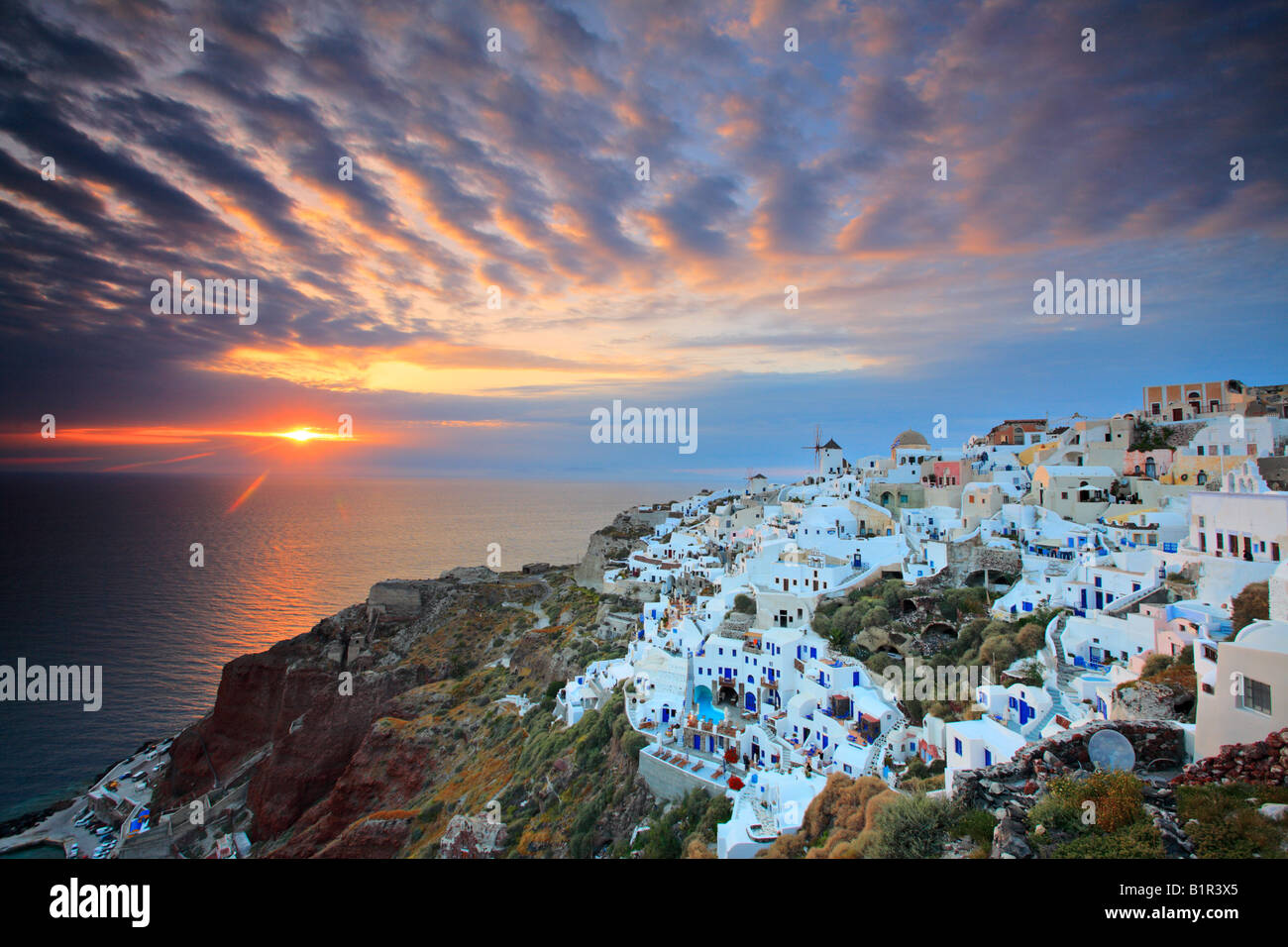 Sunset at Oia village on Santorini island Stock Photo - Alamy
