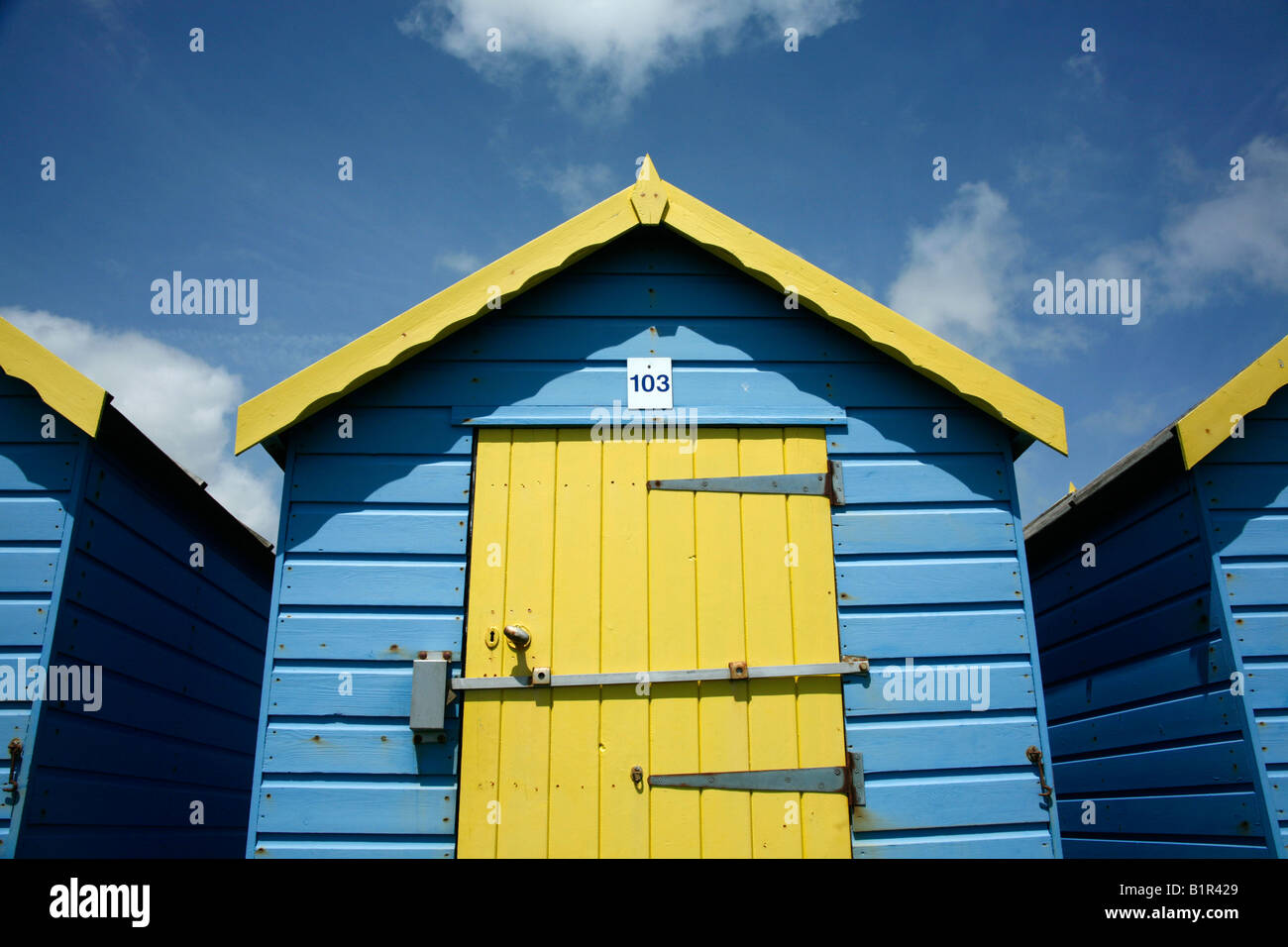 A blue and yellow beach hut Stock Photo - Alamy