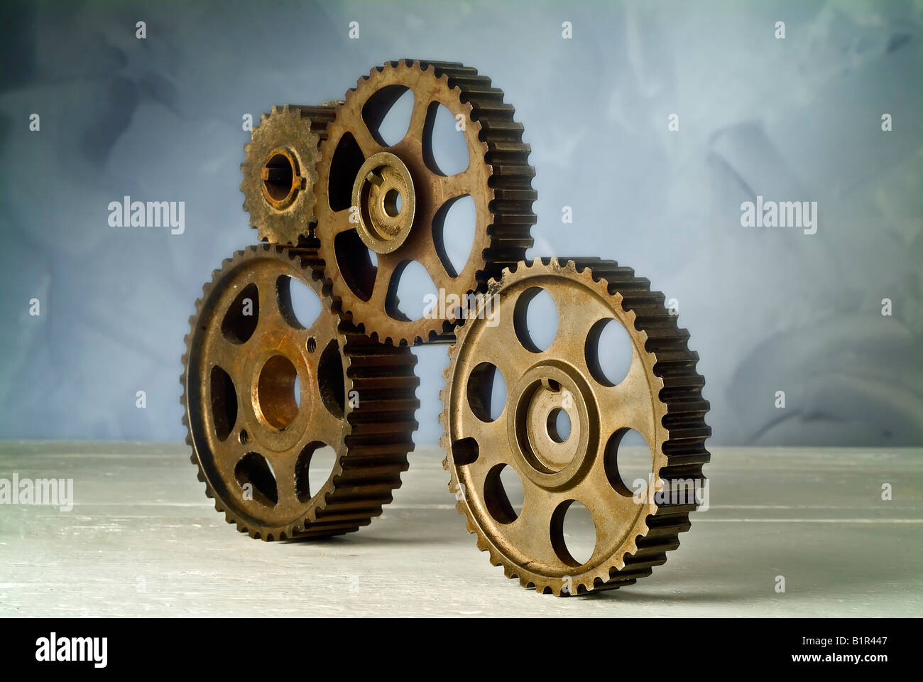 studio still life of four cog wheels Stock Photo - Alamy