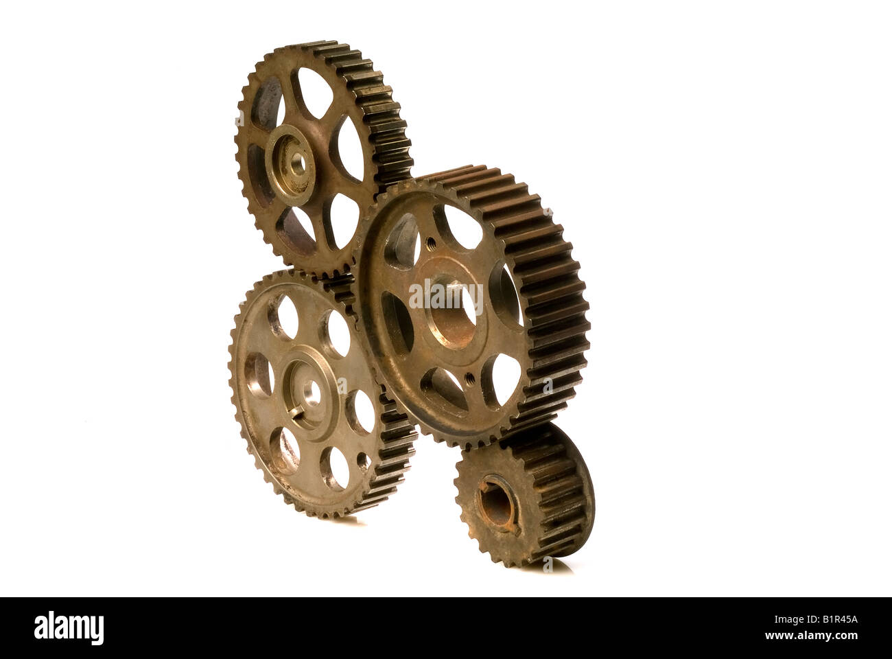 four cogwheels isolated on white Stock Photo - Alamy