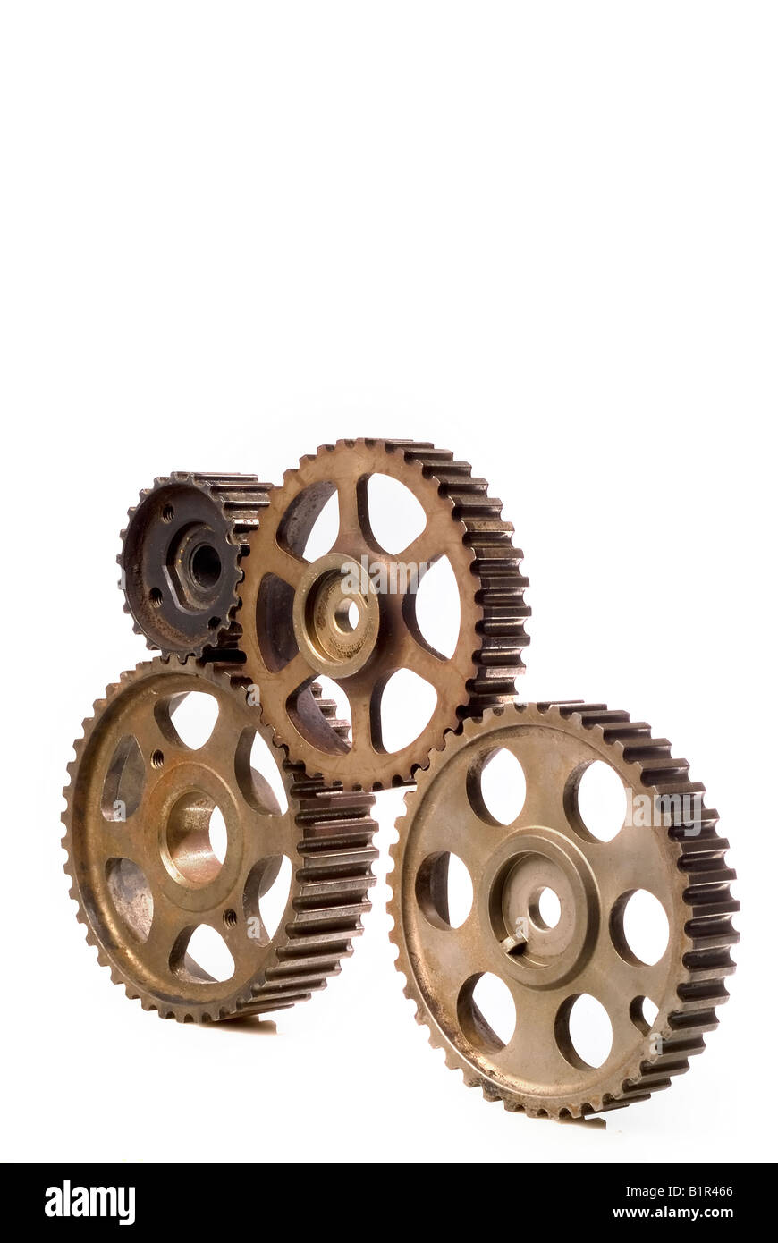 four cogwheels isolated on white Stock Photo - Alamy