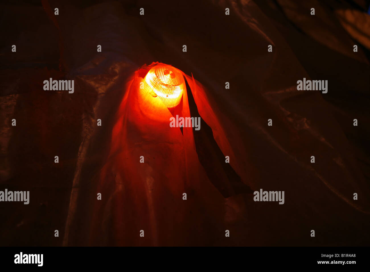 one red security light on scaffolding at night Stock Photo - Alamy
