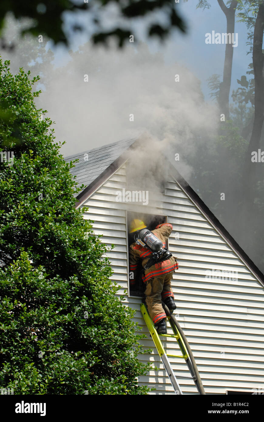 Fireman Entering Burning Building High Resolution Stock Photography and ...