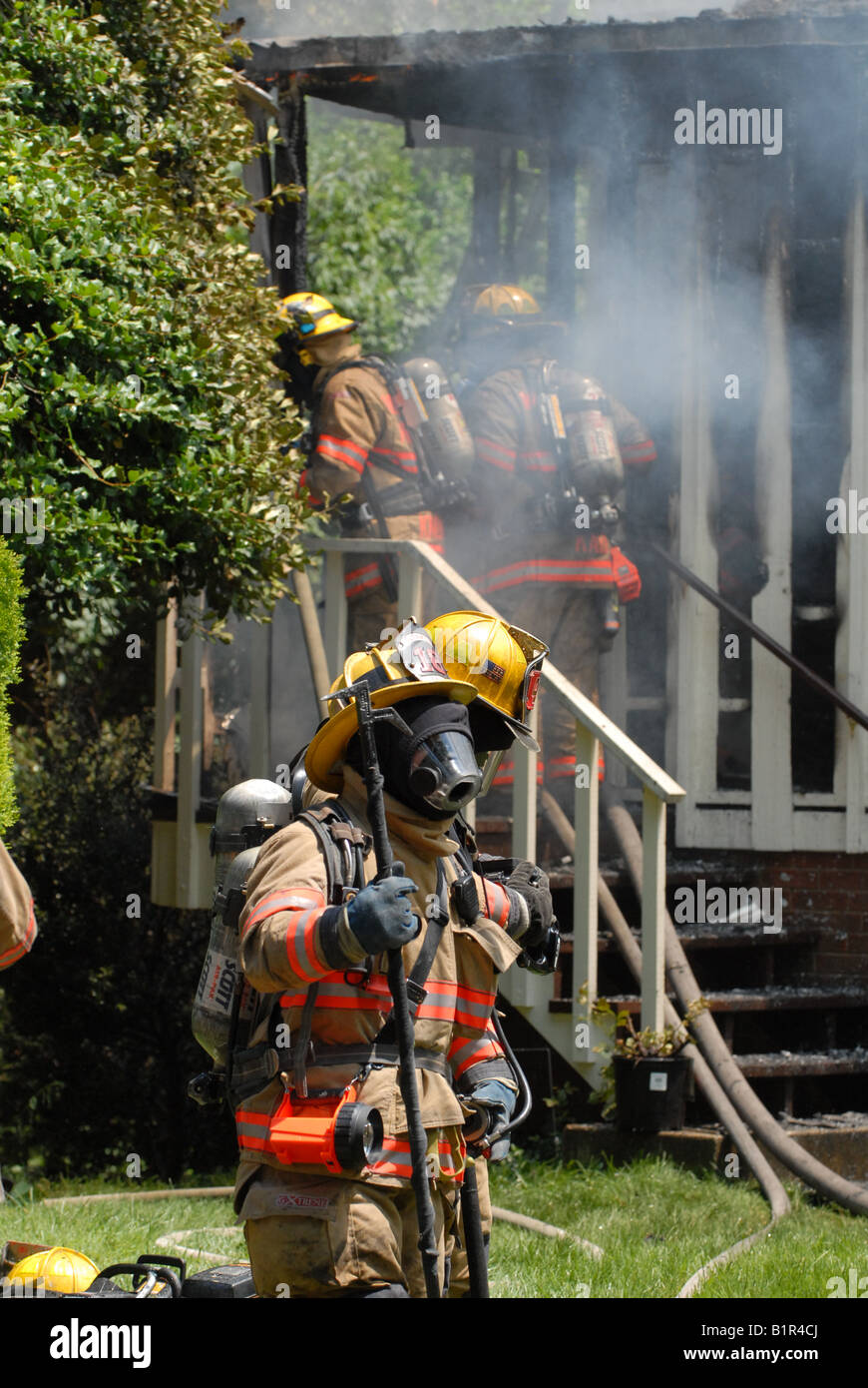 Firemen respond to extinguish a house fire in Maryland Stock Photo - Alamy