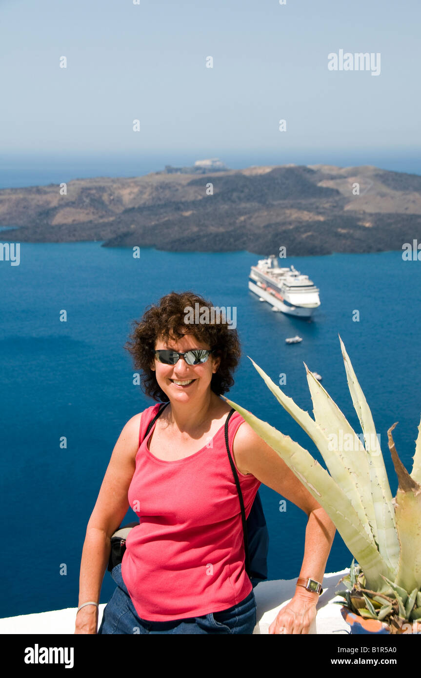 happy smiling middle age tourist in santorini greek islands with view ...