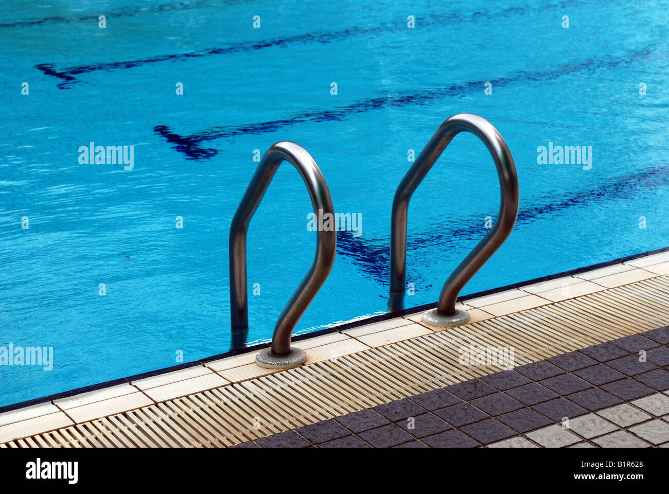 Handrail at edge of swimming pool Stock Photo - Alamy