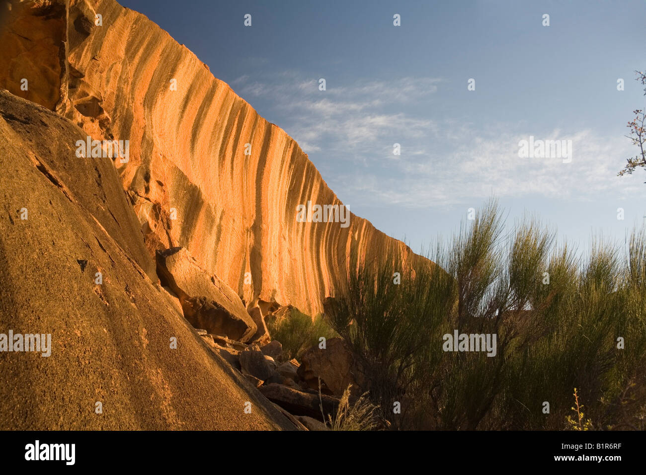 The setting sun sets 'alight' the Ochre colouring of an Australian ...