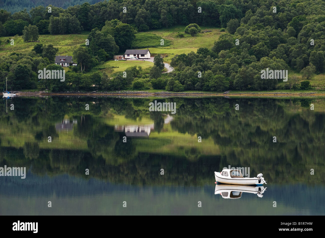 Boat reflections on Loch Eil, Lochaber, West coast, Scotland Stock ...