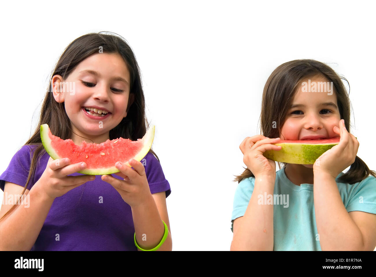 Two girls eating Watermelon isolated on white background Stock Photo ...