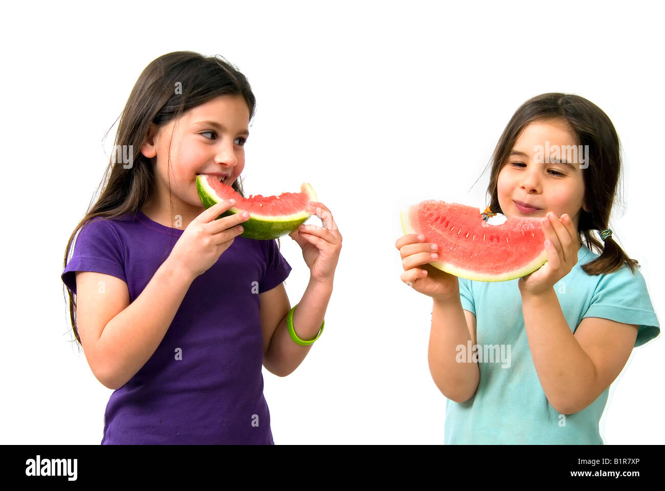 Two girls Watermelon isolated on white background Stock Photo - Alamy