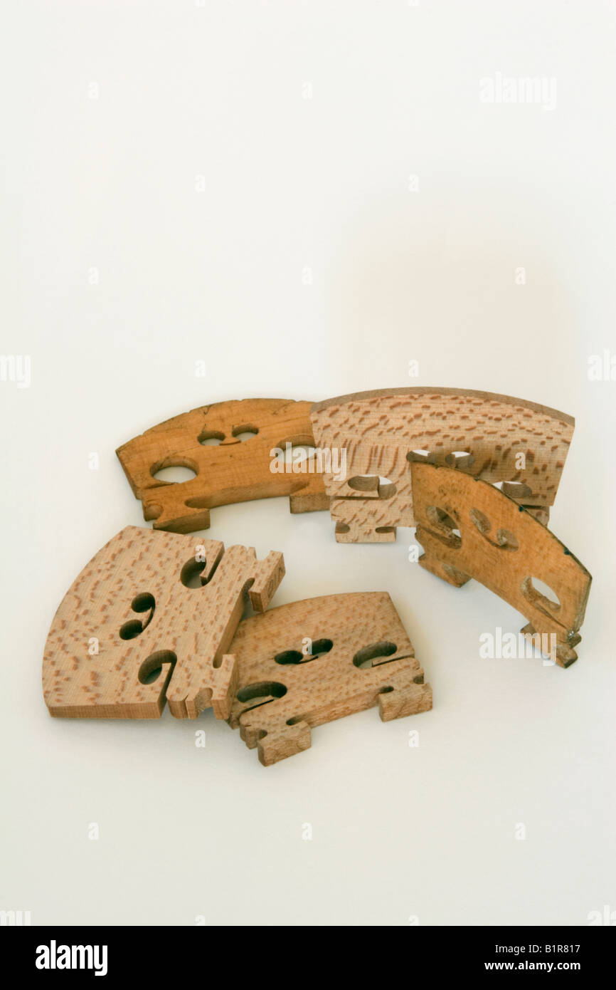Worked and new violin bridges Stock Photo - Alamy
