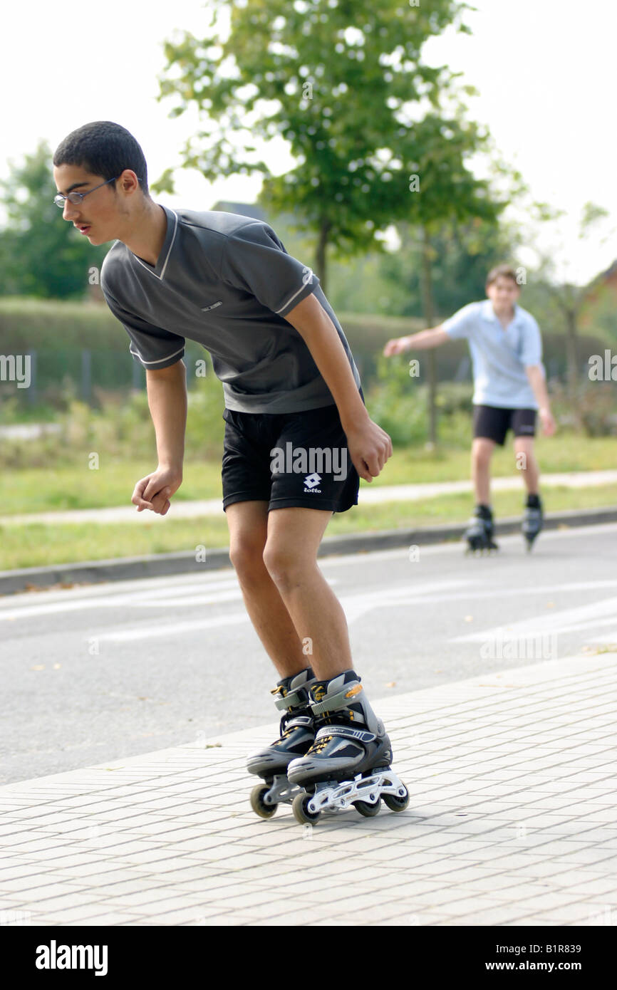 teenagers inline skating Stock Photo - Alamy