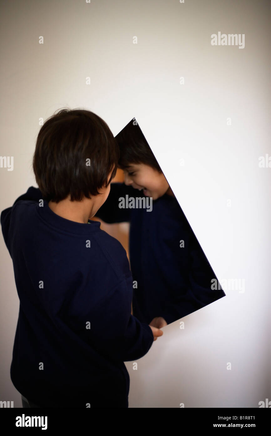 Child reflected in mirror boy aged six years Stock Photo - Alamy