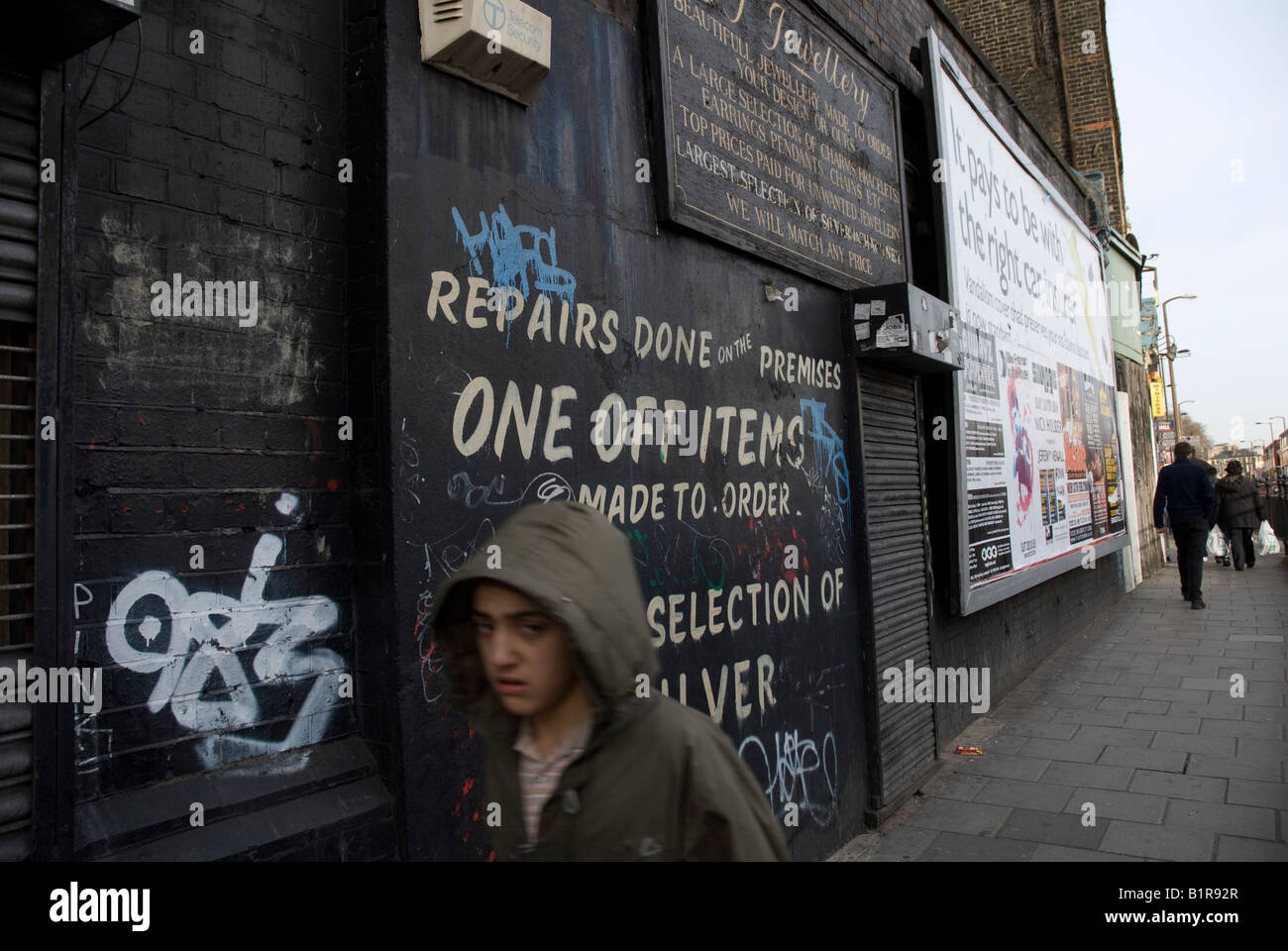 A young boy passes thorough a run down inner city area of Dalston ...