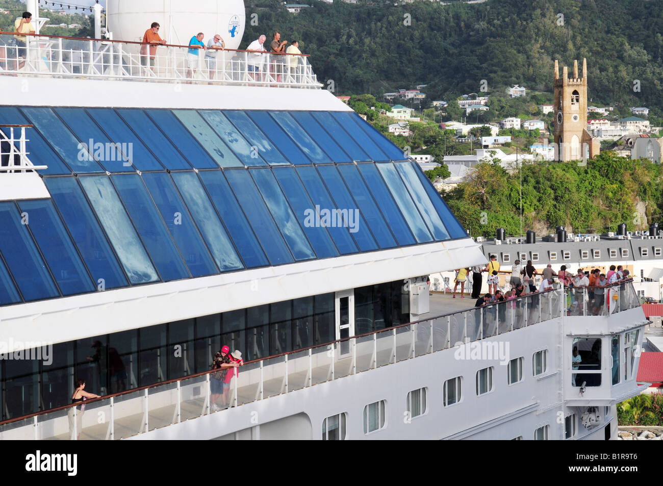 Cruise ship passengers watch as their vessel departs from Grenada in ...