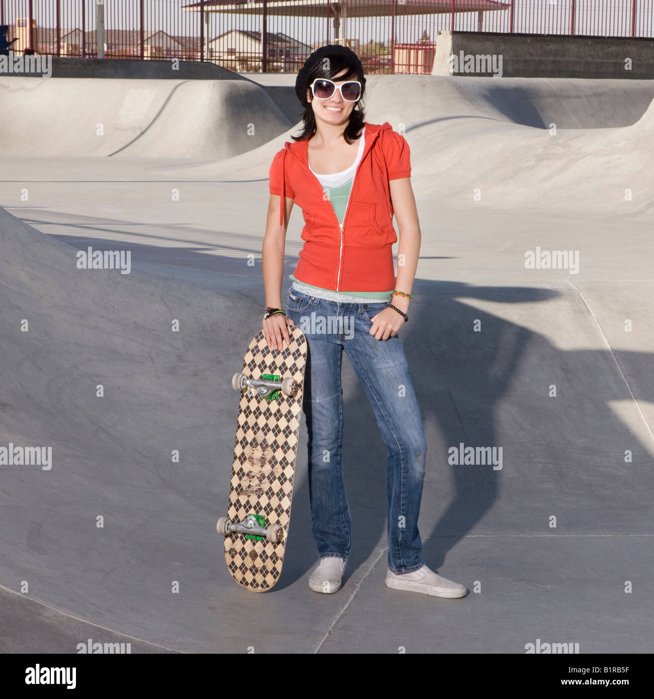 Girl with skateboard at the park Stock Photo - Alamy