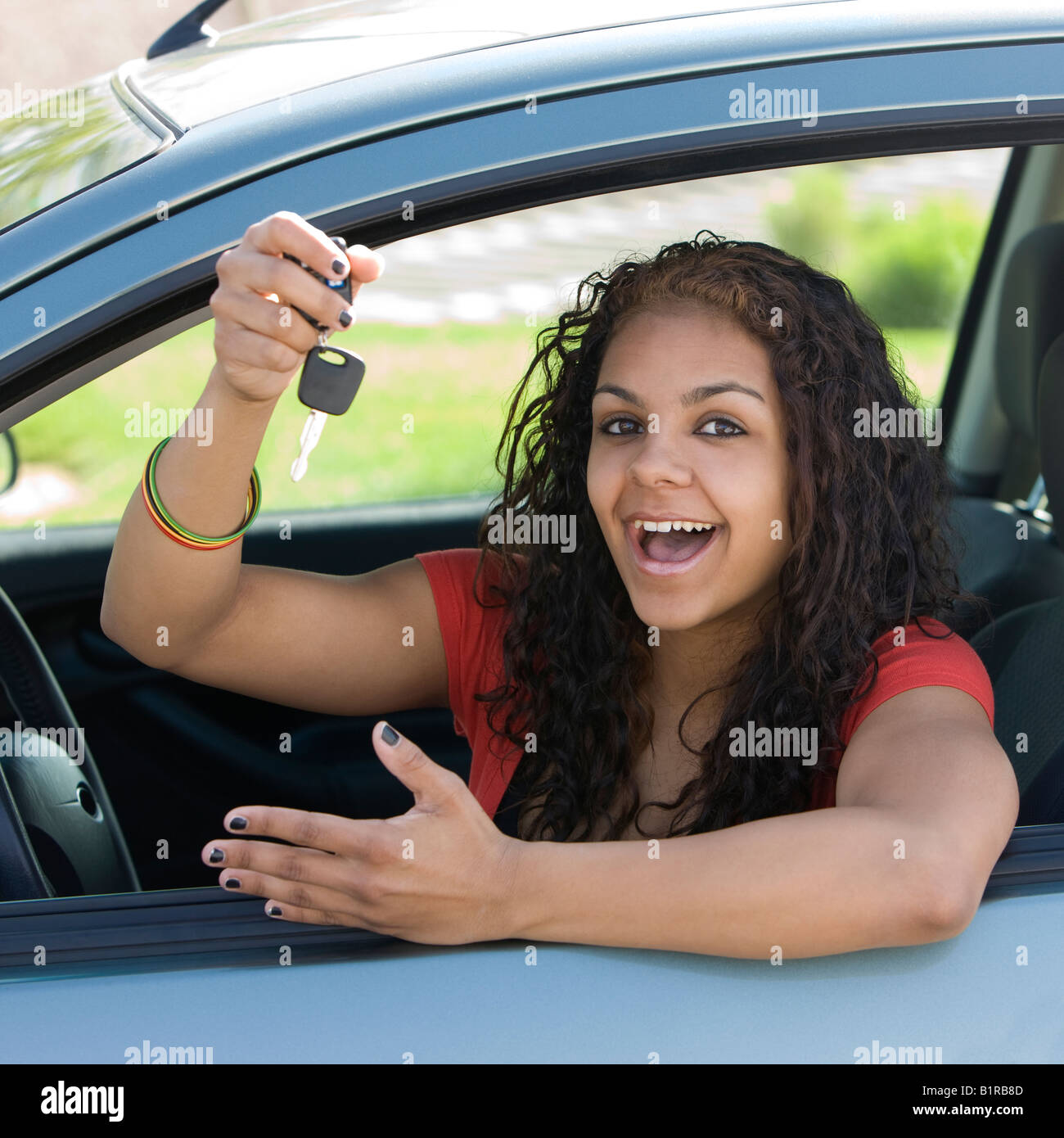 Teen driver inside car with keys smiles Stock Photo - Alamy