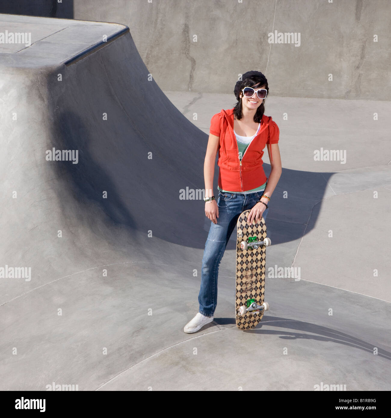 Girl with skateboard at the park Stock Photo - Alamy
