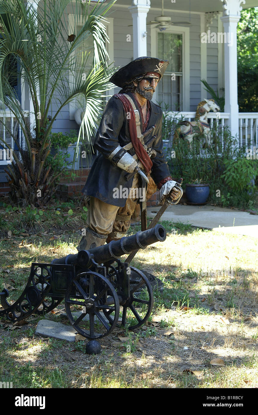Pirate figurehead and small cannon outside Victorian Porch Stock Photo ...