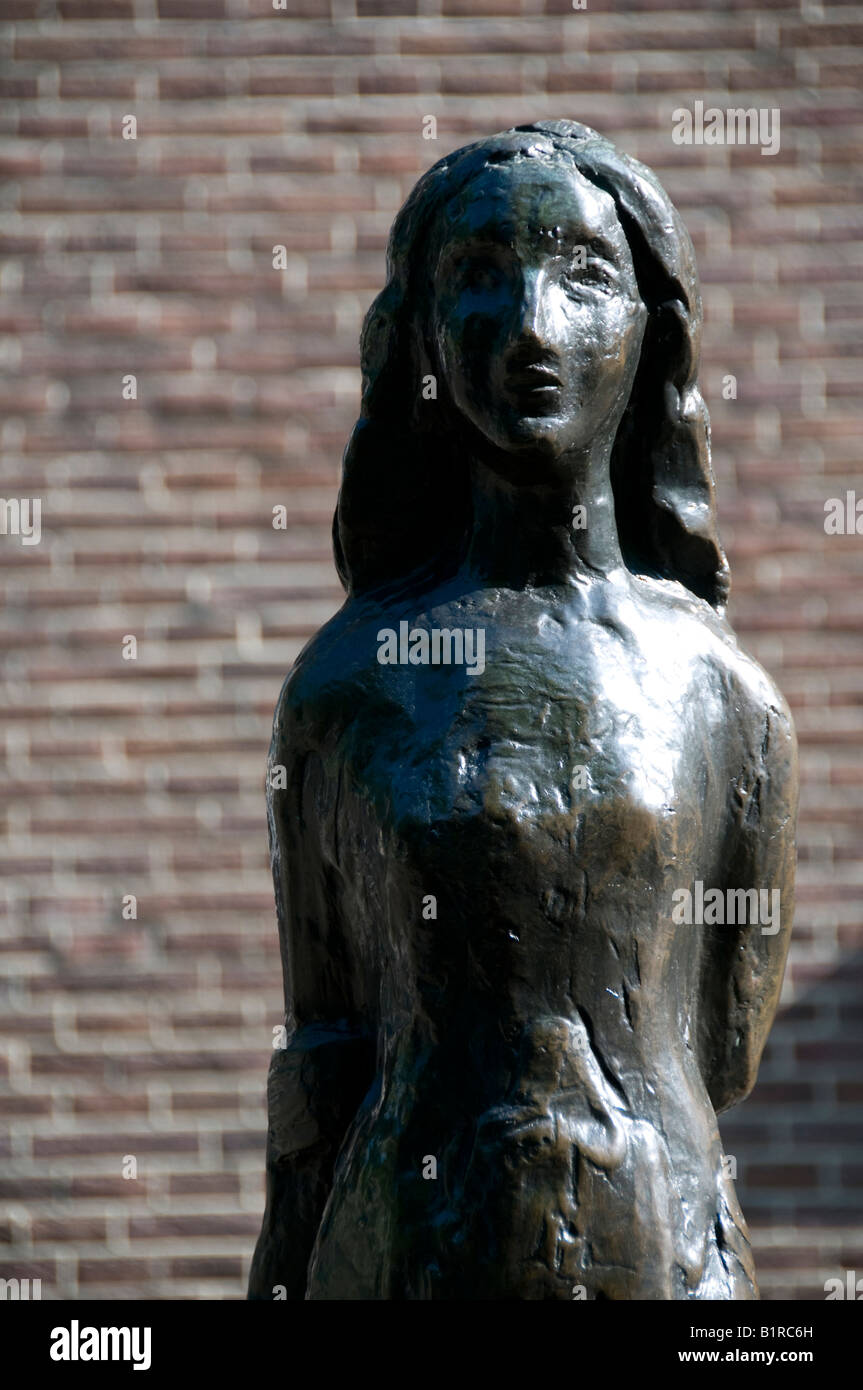 Statue of Anne Frank stands on Westerkerk plaza near the Anne Frank ...