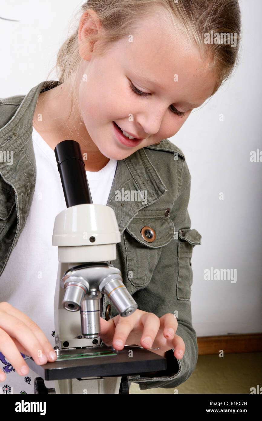 Stock Photograph of student using a microscope Stock Photo - Alamy