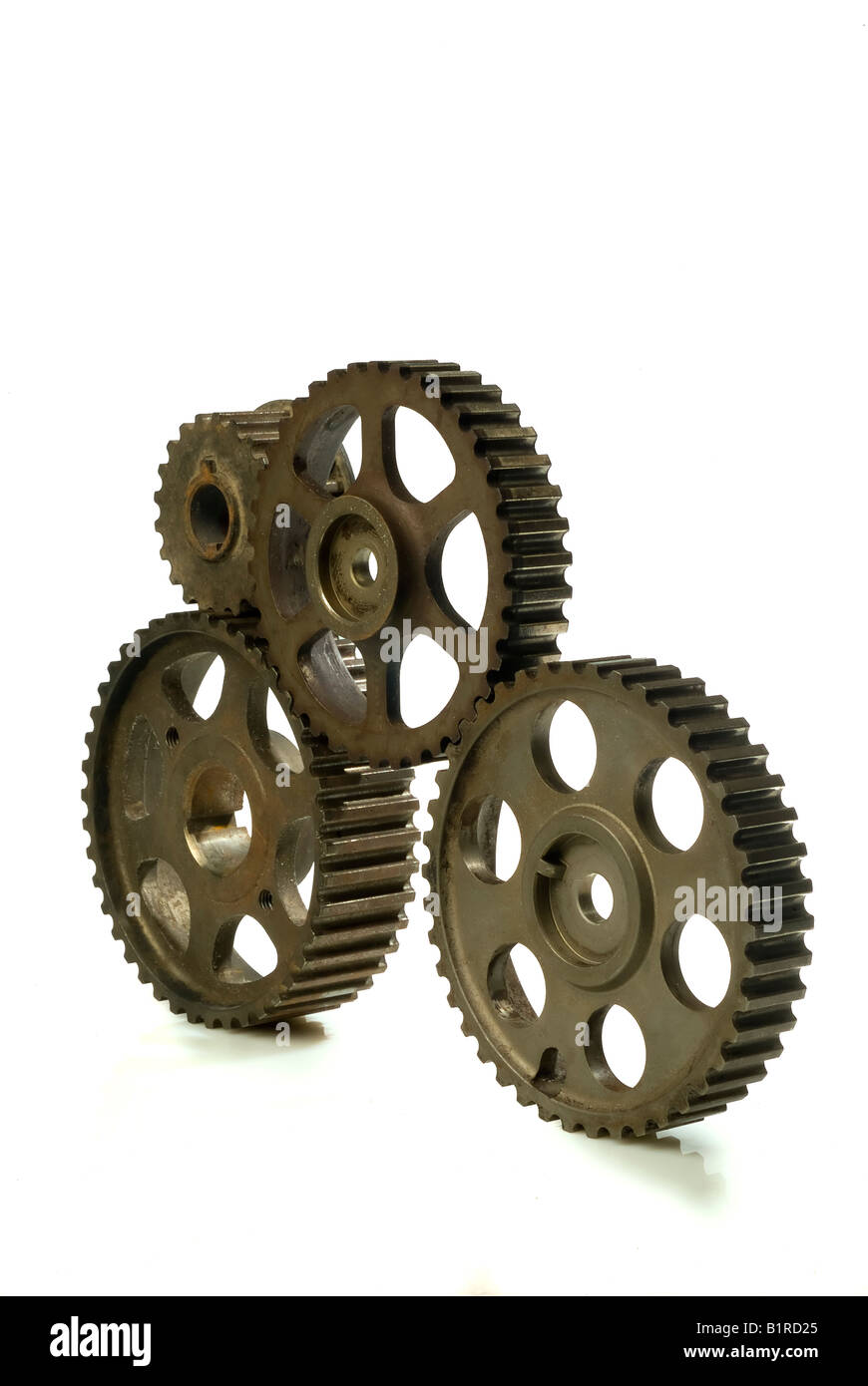 four cogwheels isolated on white Stock Photo - Alamy