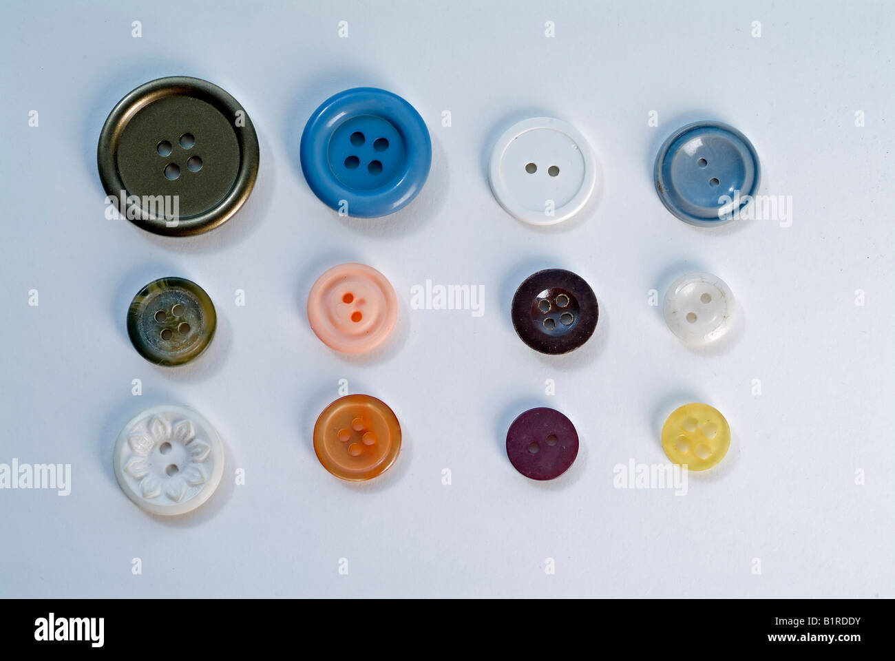 multi color and shape buttons on white Stock Photo - Alamy