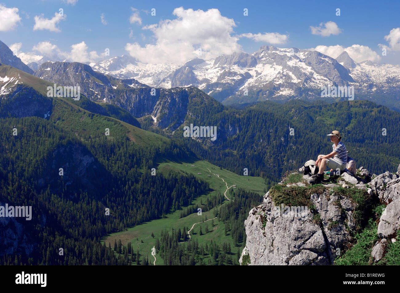 Woman sitting on the summit of Mt. Jenner, Berchtesgaden National Park ...
