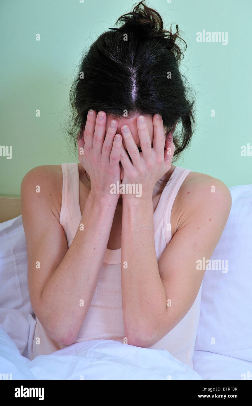 Crying woman head in hands hi-res stock photography and images - Alamy