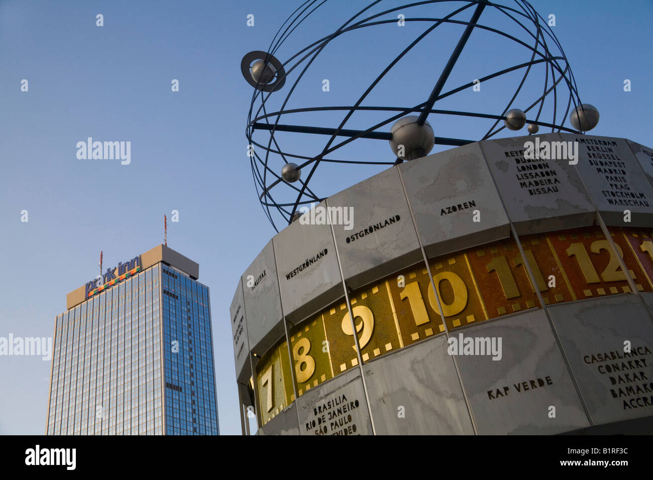 World time clock and Park Inn Hotel on Alexanderplatz Square, Berlin ...