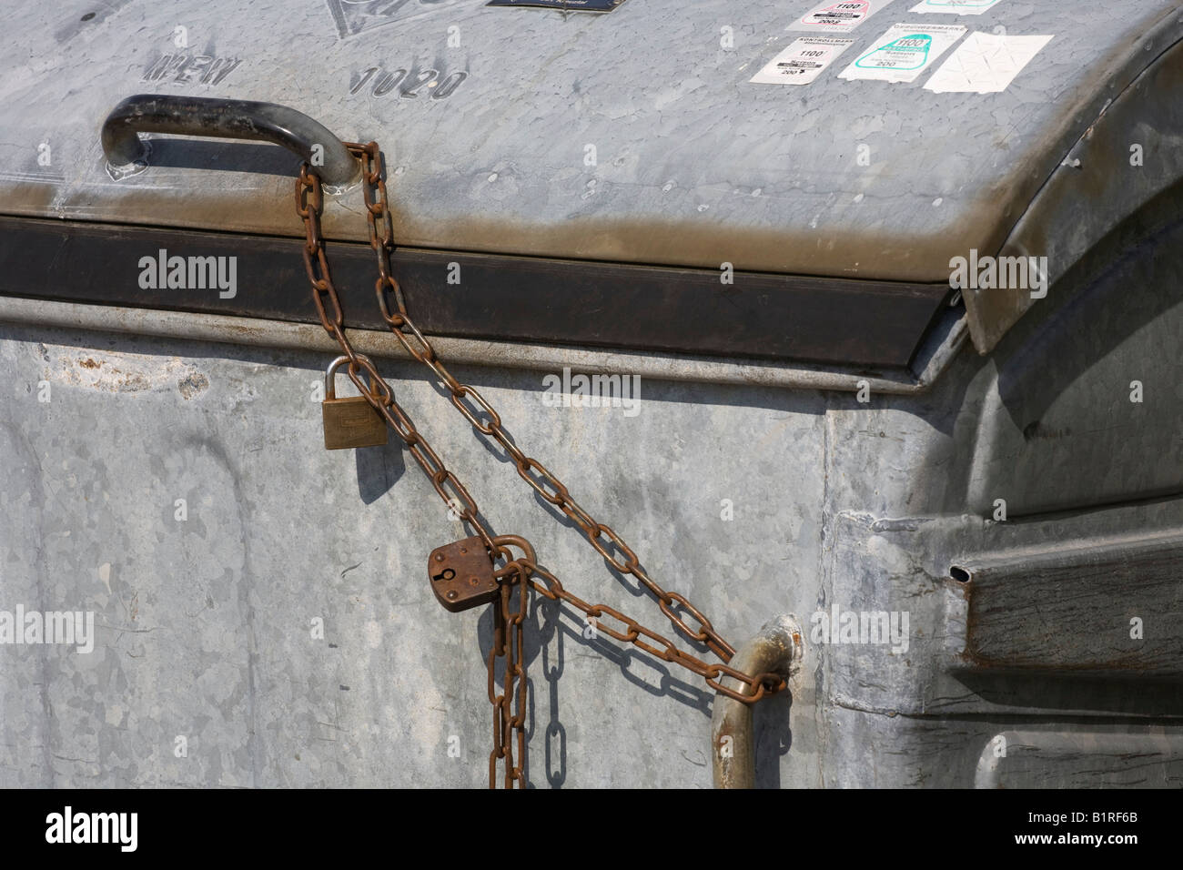 Rubbish container locked padlock chain hi-res stock photography and ...