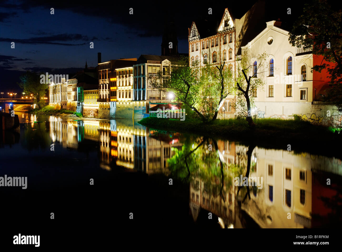 Facades, lit up, on the River Oder in Opole, Silesia, Poland, Europe ...