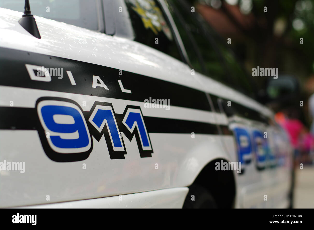 Dial 911 written on the side of police car Stock Photo - Alamy