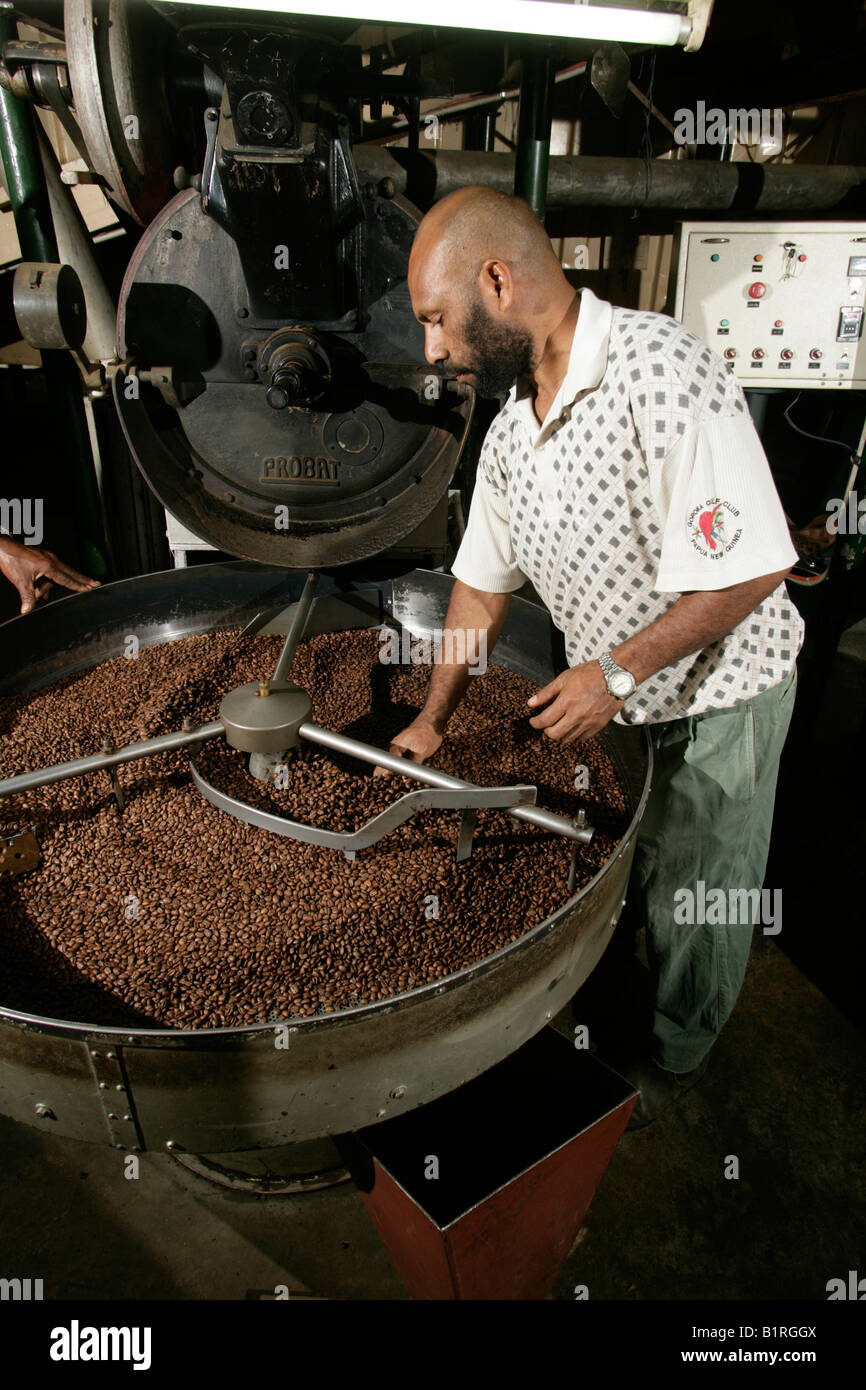 A man at a roastery is roasting coffee, Goroka, Papua New Guinea ...