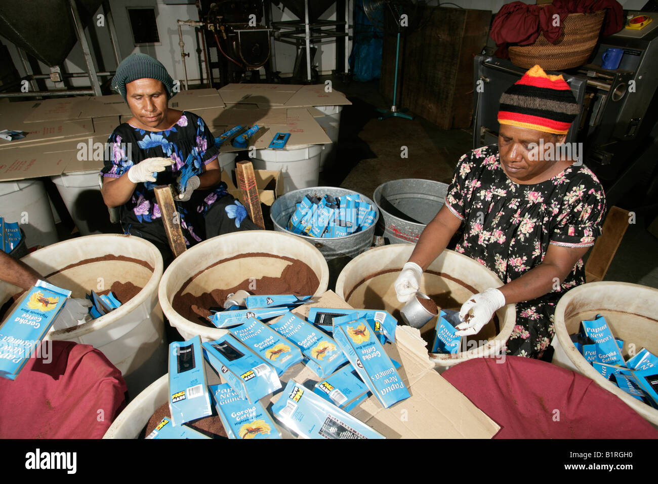 Women are packaging highlands coffee, roastery, Goroka, Papua New ...