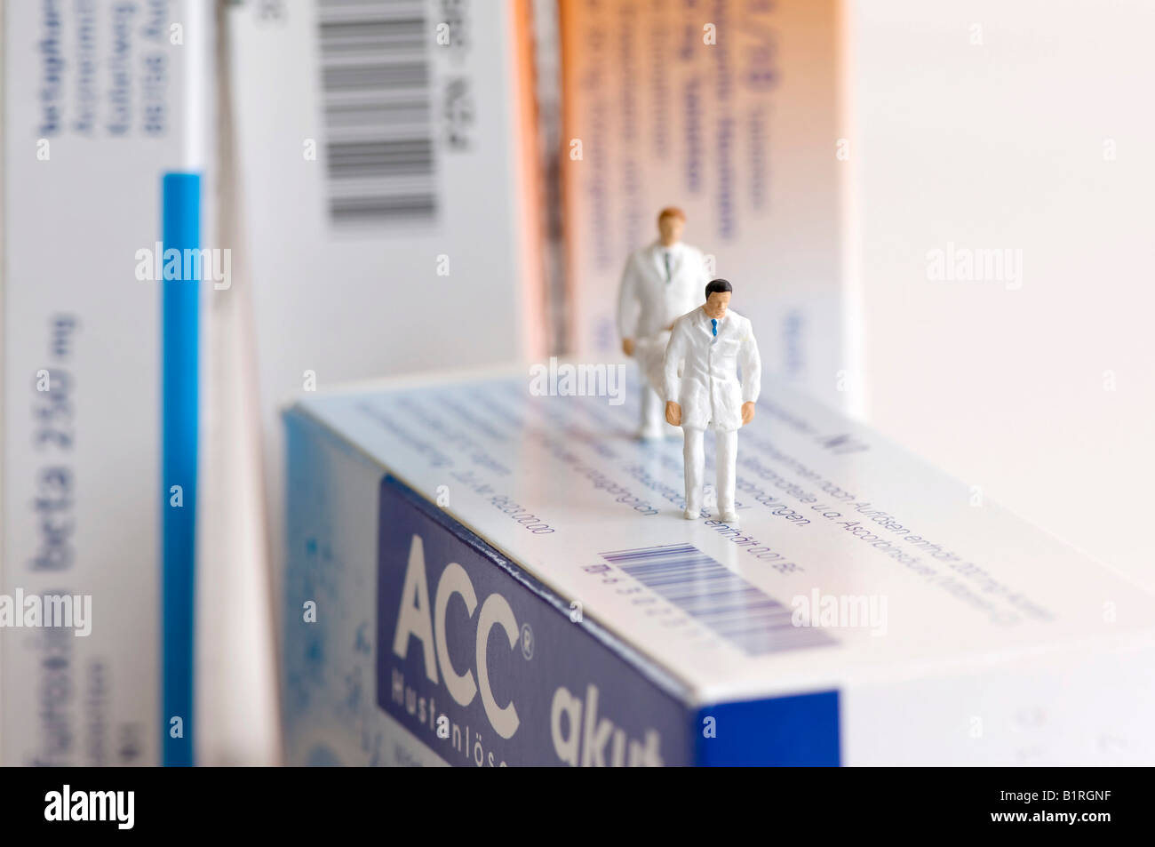 Tablet boxes and miniature paramedics carrying a patient on a stretcher ...