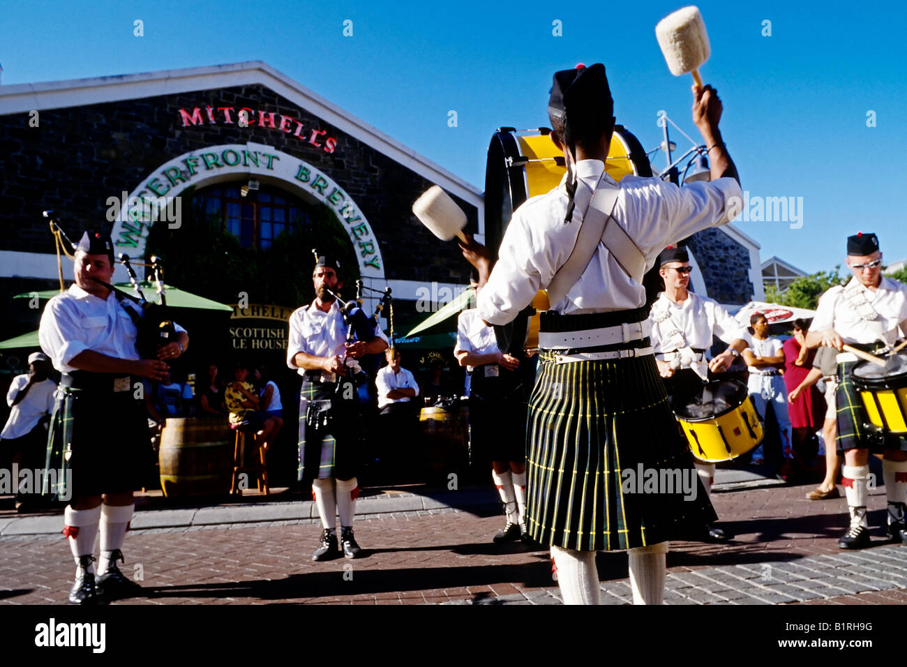 Highlander band performing in front of a brewery, V & A Waterfront ...