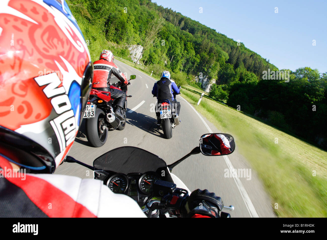 3 motorcyclists on the road Stock Photo - Alamy