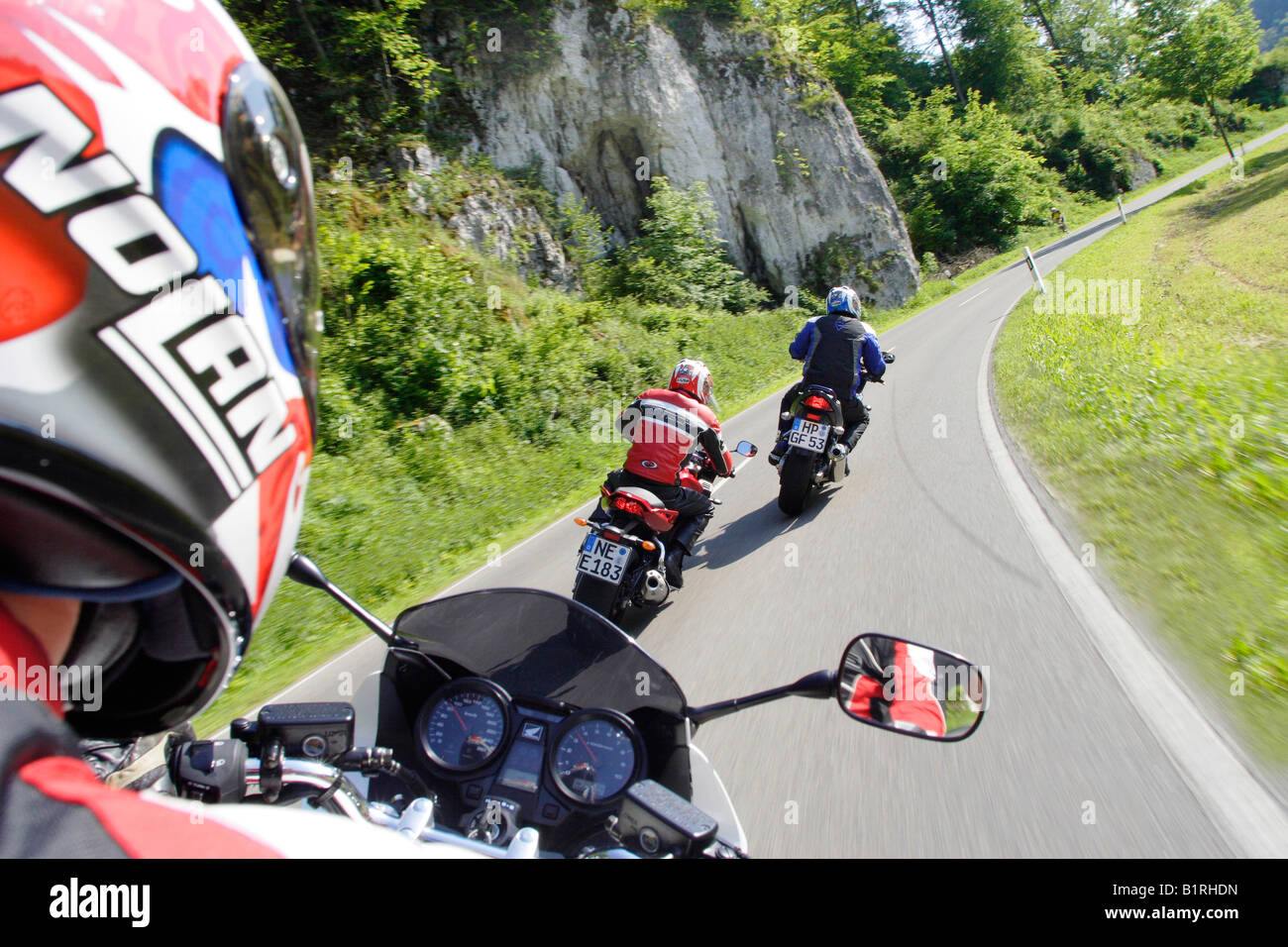 3 motorcyclists on the road Stock Photo - Alamy