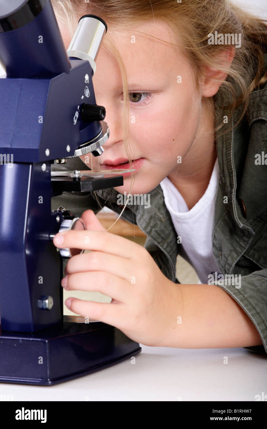 Stock Photograph of student using a microscope Stock Photo - Alamy