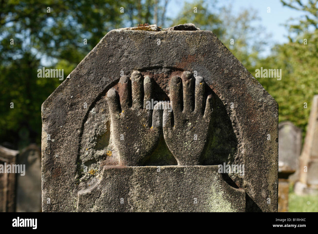 Gravestone of a priest with blessing hands in the Jewish cemetery on ...